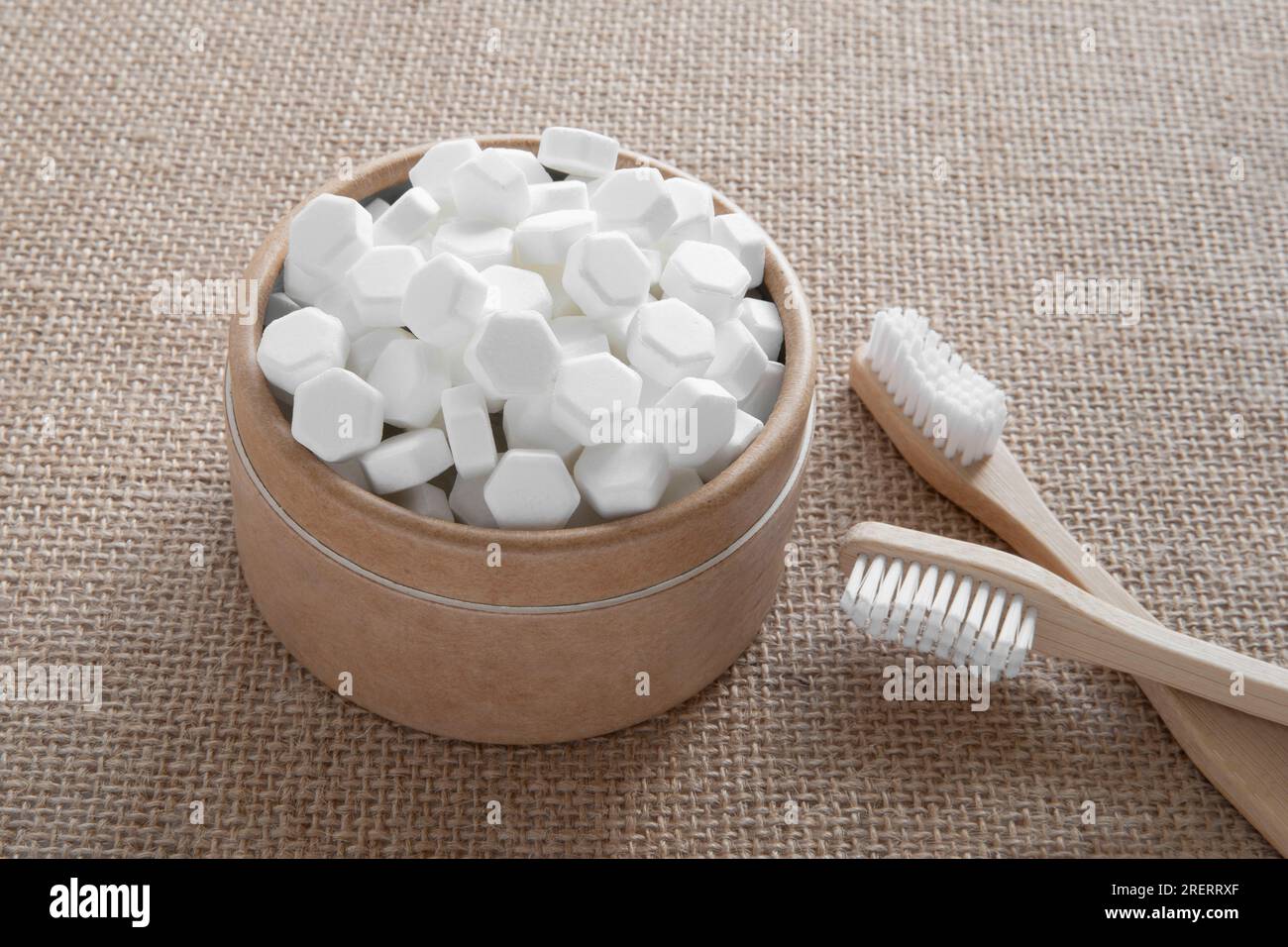 White solid toothpaste tablet with bamboo toothbrush Stock Photo - Alamy