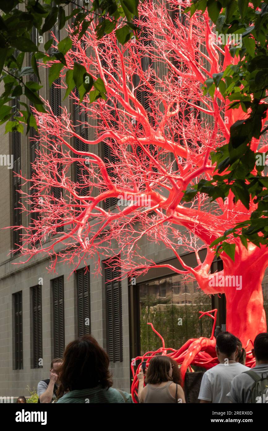 The old tree is a pink and red 25 foot tall sculpture comprised of man ...