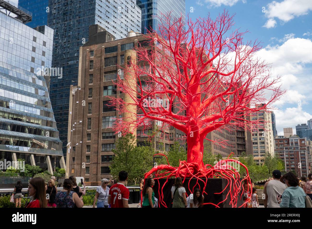 The old tree is a pink and red 25 foot tall sculpture comprised of man ...