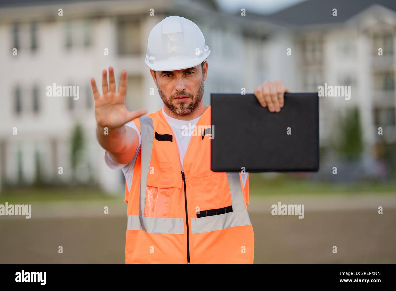 Builder with stop gesture, no hand, dangerous on building concept ...