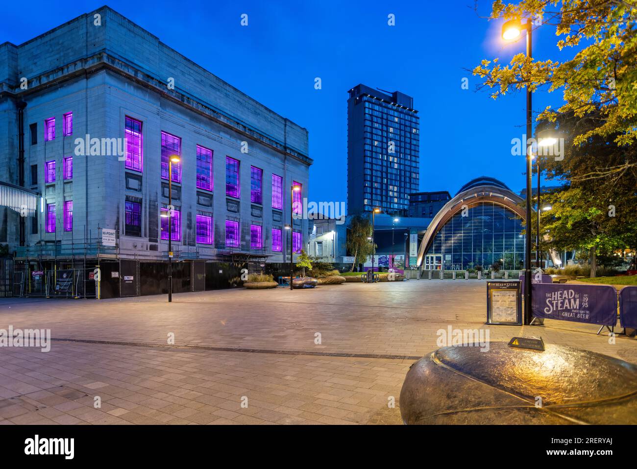 Winter gardens and the Central Library lit up at night in Tudor Square ...