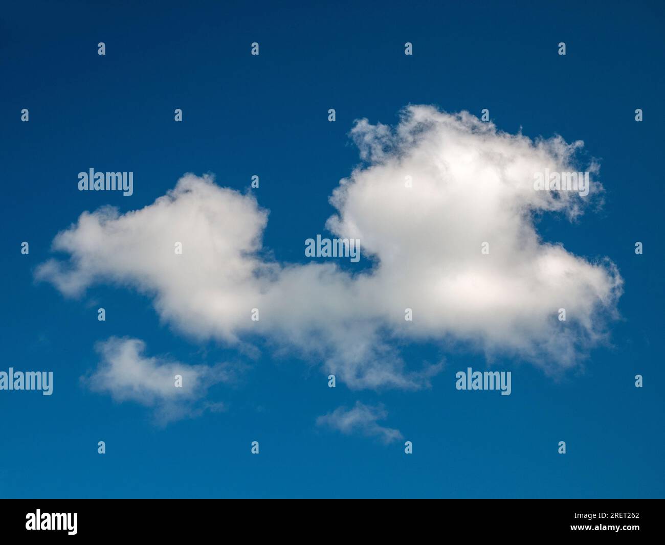 Single white cloud over blue sky background. Fluffy cumulus cloud shape ...