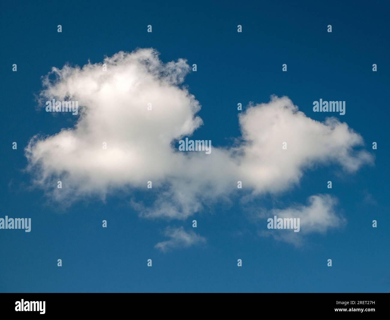 Single white cloud over blue sky background. Fluffy cumulus cloud shape ...