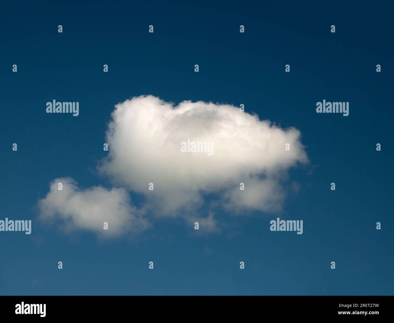 Single white cloud over blue sky background. Fluffy cumulus cloud shape ...