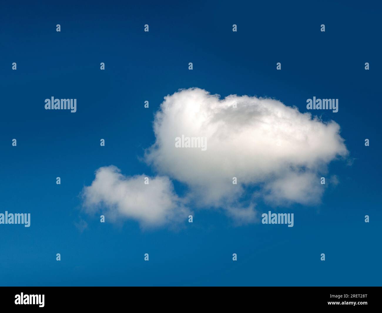Single white cloud over blue sky background. Fluffy cumulus cloud shape ...
