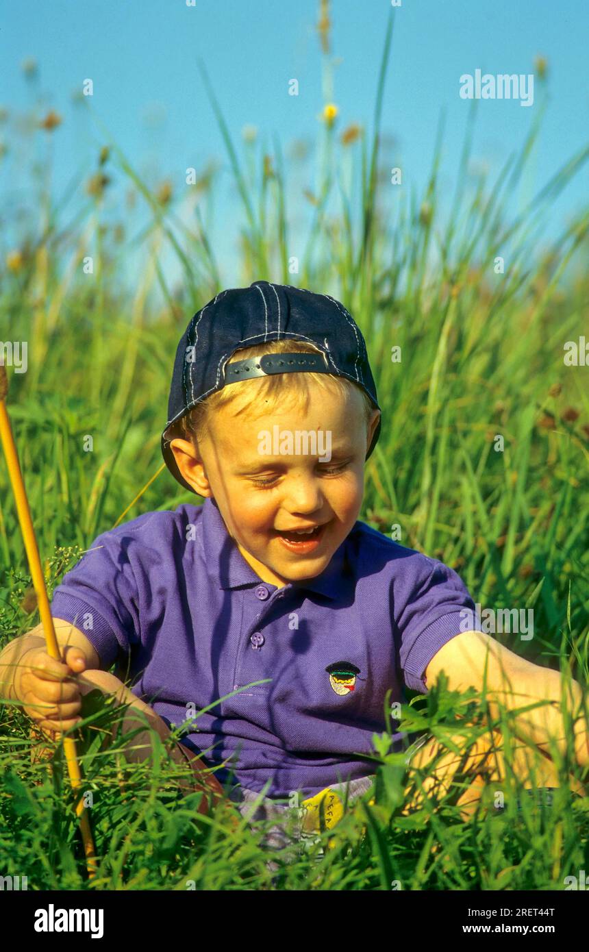 Child under 2 years, little boy sitting in the grass Stock Photo - Alamy