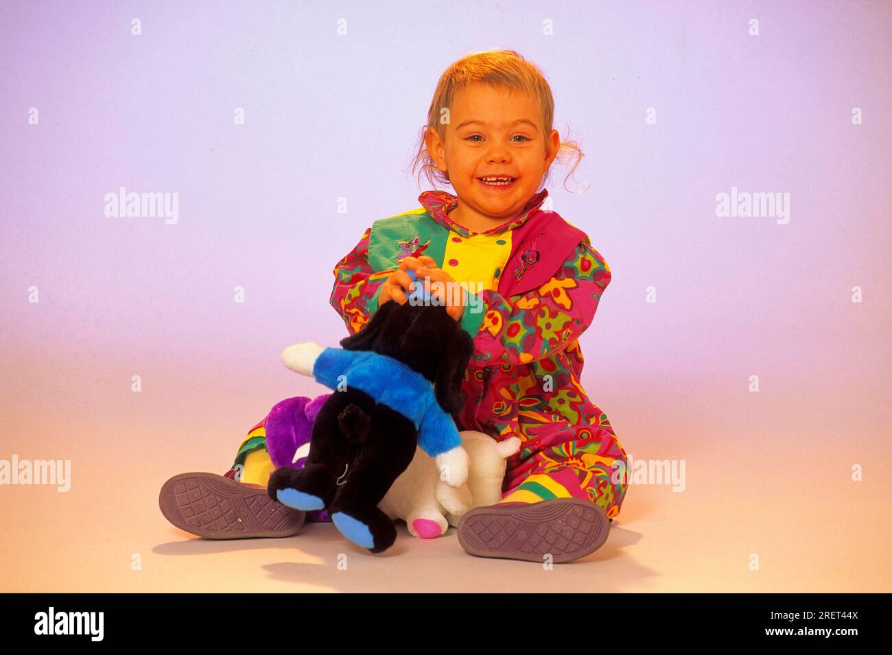 Child under 3 years, girl squeezes her cuddly toy Stock Photo - Alamy