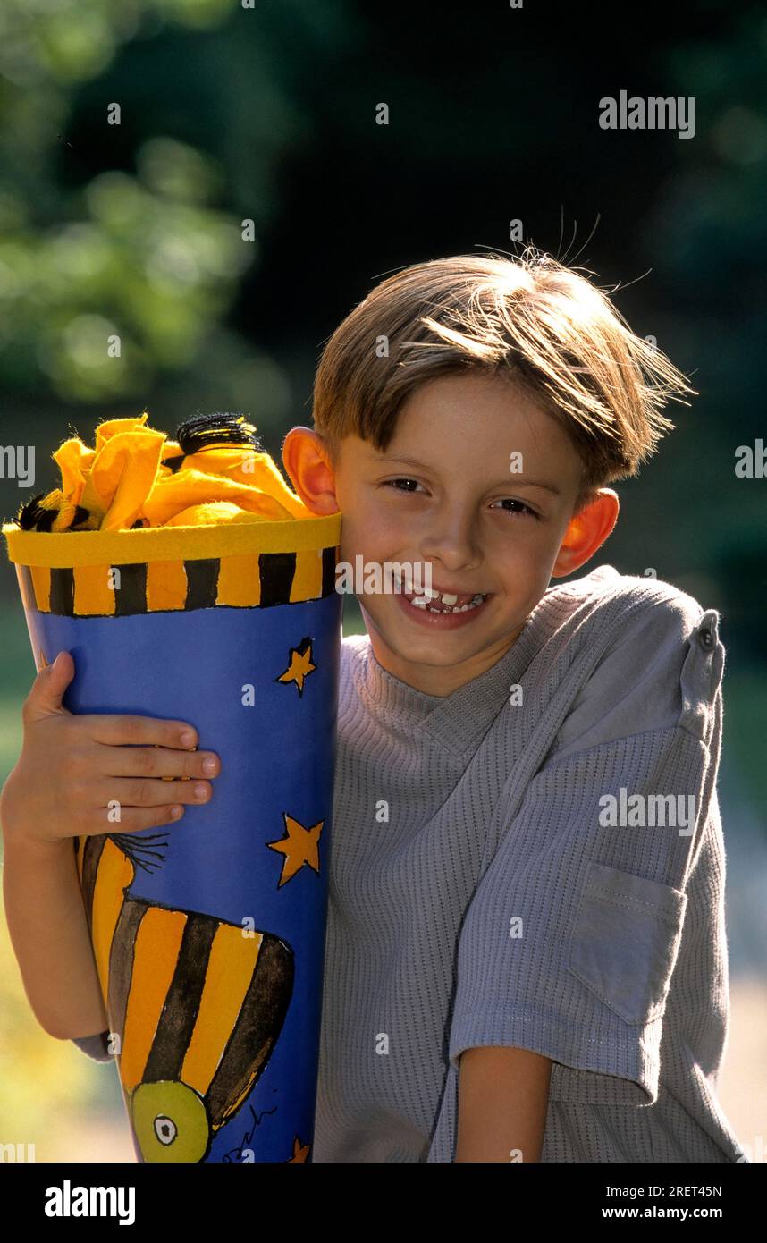 Boy with school cone Stock Photo - Alamy