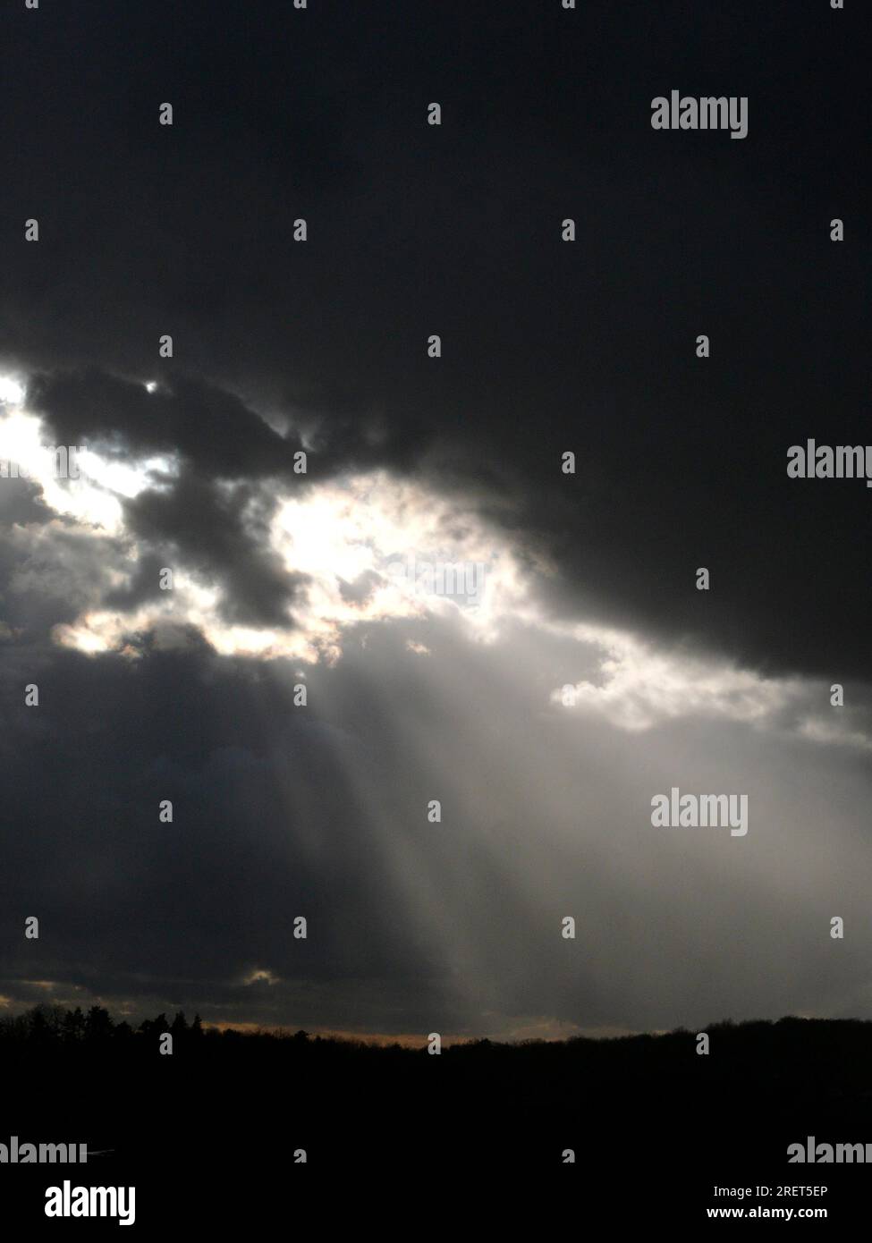 Rain clouds with sun rays, cloudy atmosphere Stock Photo - Alamy