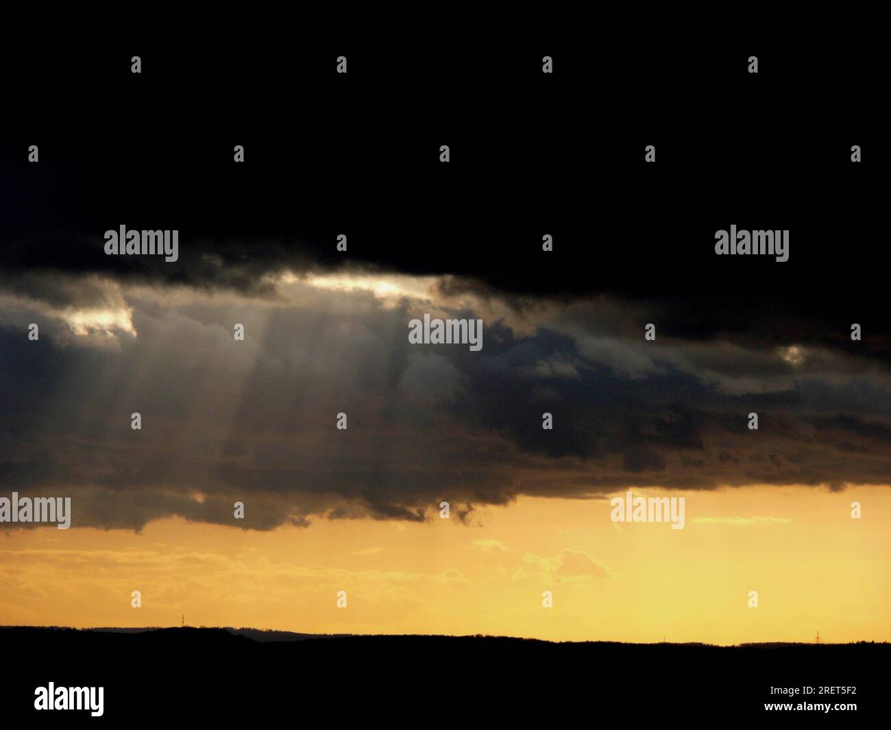 Rain clouds with sun rays, cloudy atmosphere Stock Photo - Alamy