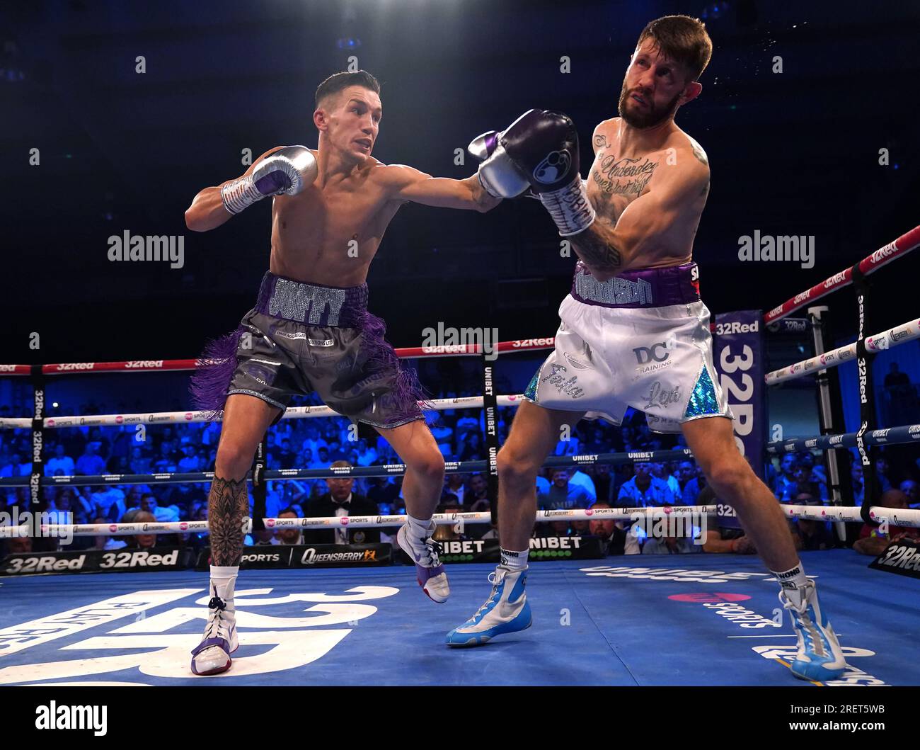 Liam Davies (left) and Jason Cunningham in the super bantam weight bout ...