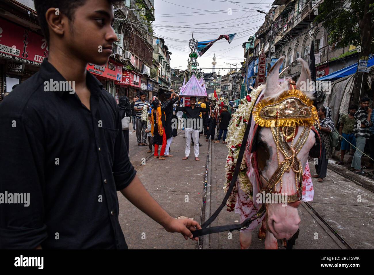Kolkata, India. 29th July, 2023. A Shia Muslim boy with a horse ...