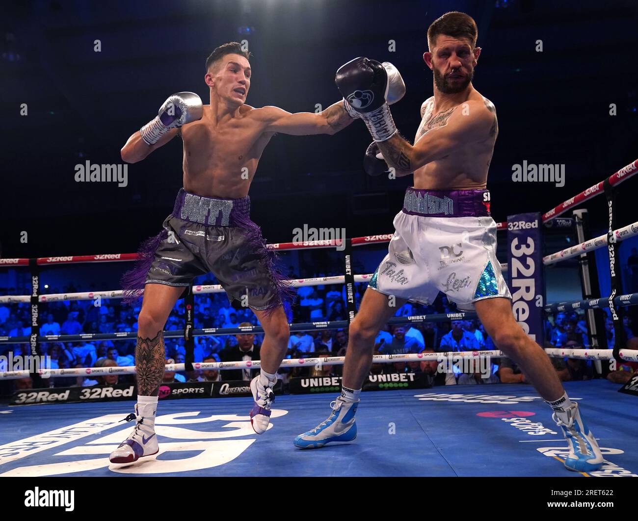 Liam Davies (left) and Jason Cunningham in the super bantam weight bout ...