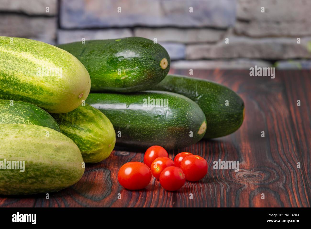 Courgettes (Cucurbita pepo), field cucumbers (Cucumis sativus ...