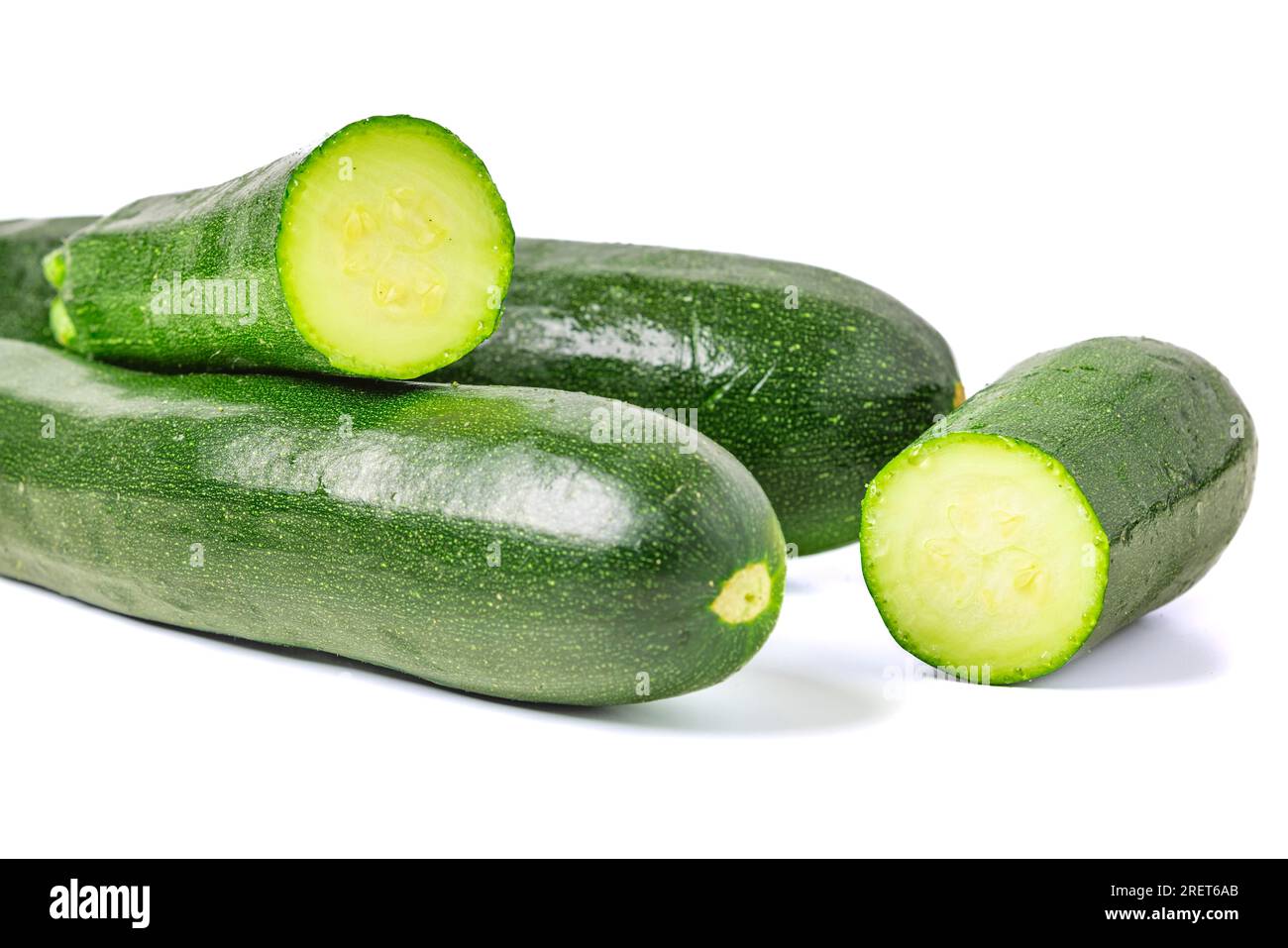 Courgettes (Cucurbita pepo), whole and cut, on white Stock Photo - Alamy