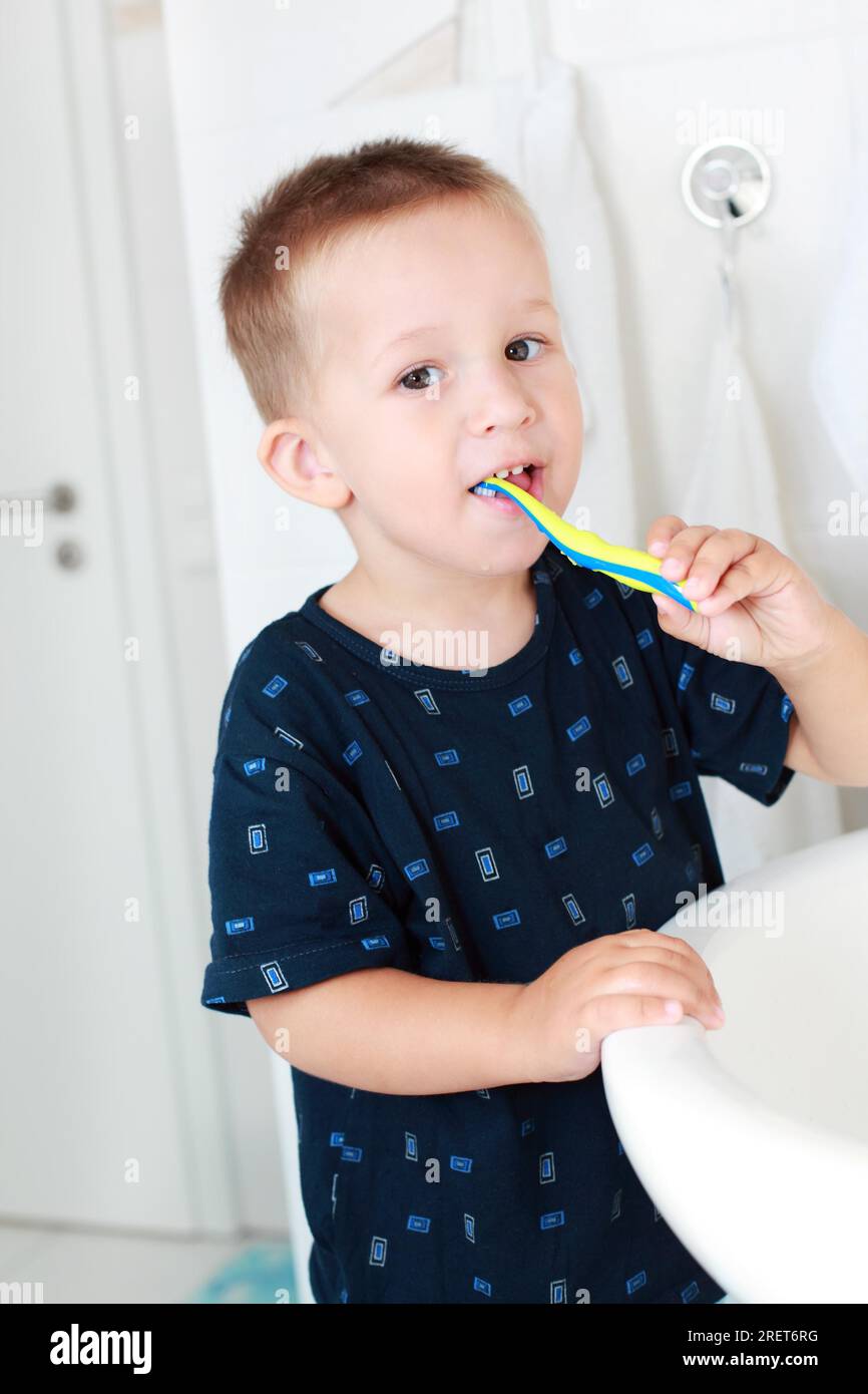 Dental care - small boy washing his teeth Stock Photo - Alamy
