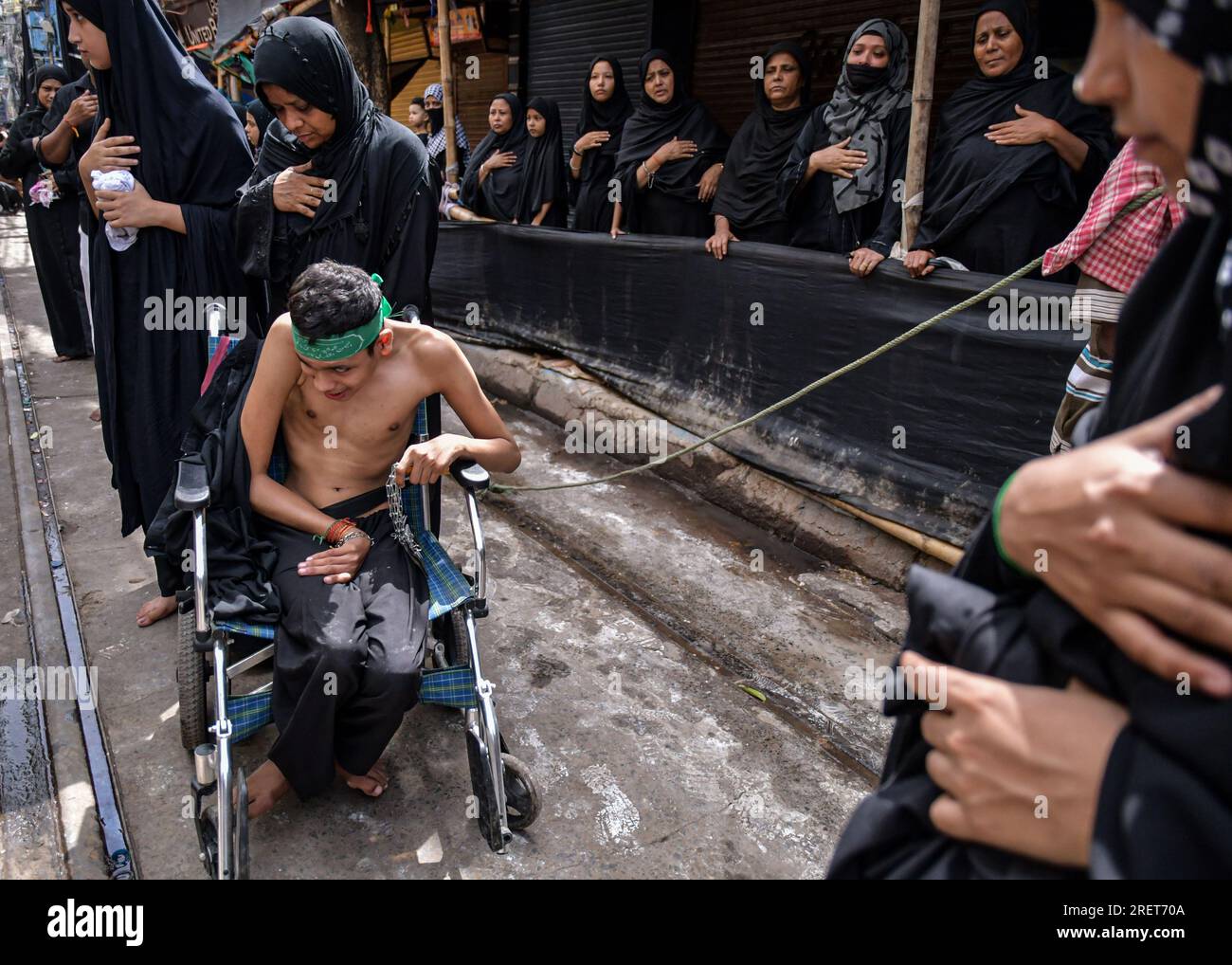A specially-abled Shia Muslim boy holding sharp blades awaits to ...