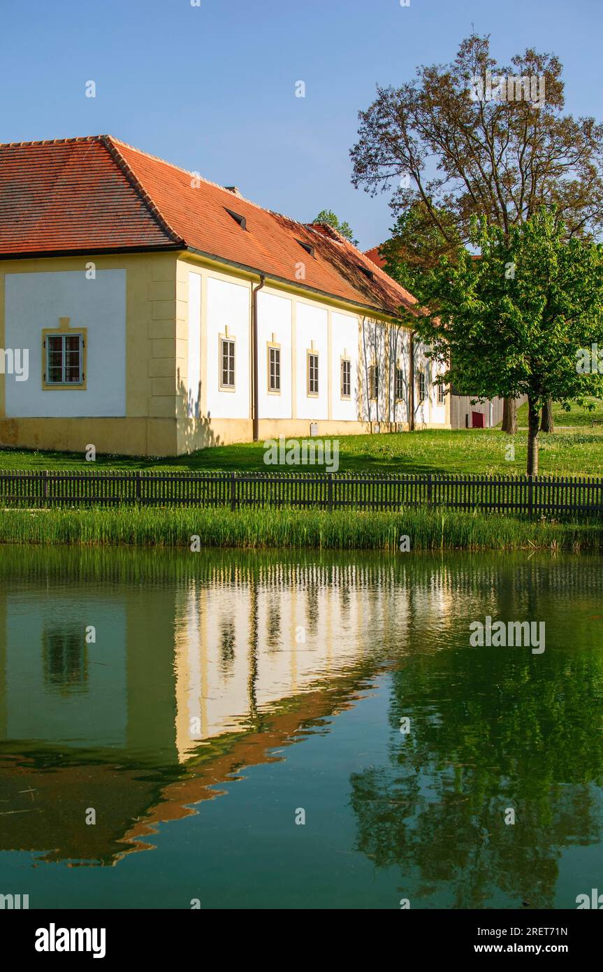 Annex building and pond of a castle Stock Photo - Alamy