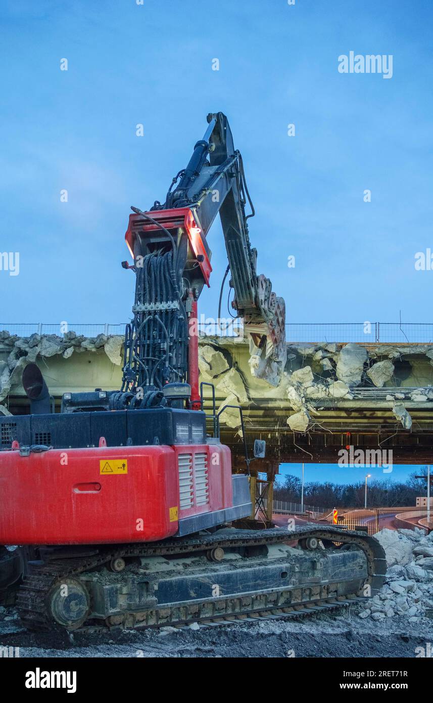 Excavator at demolition of a motorway Stock Photo - Alamy