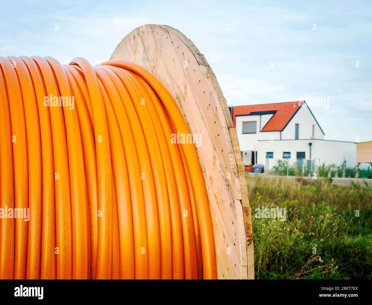 Communication cable in orange on a roll Stock Photo - Alamy