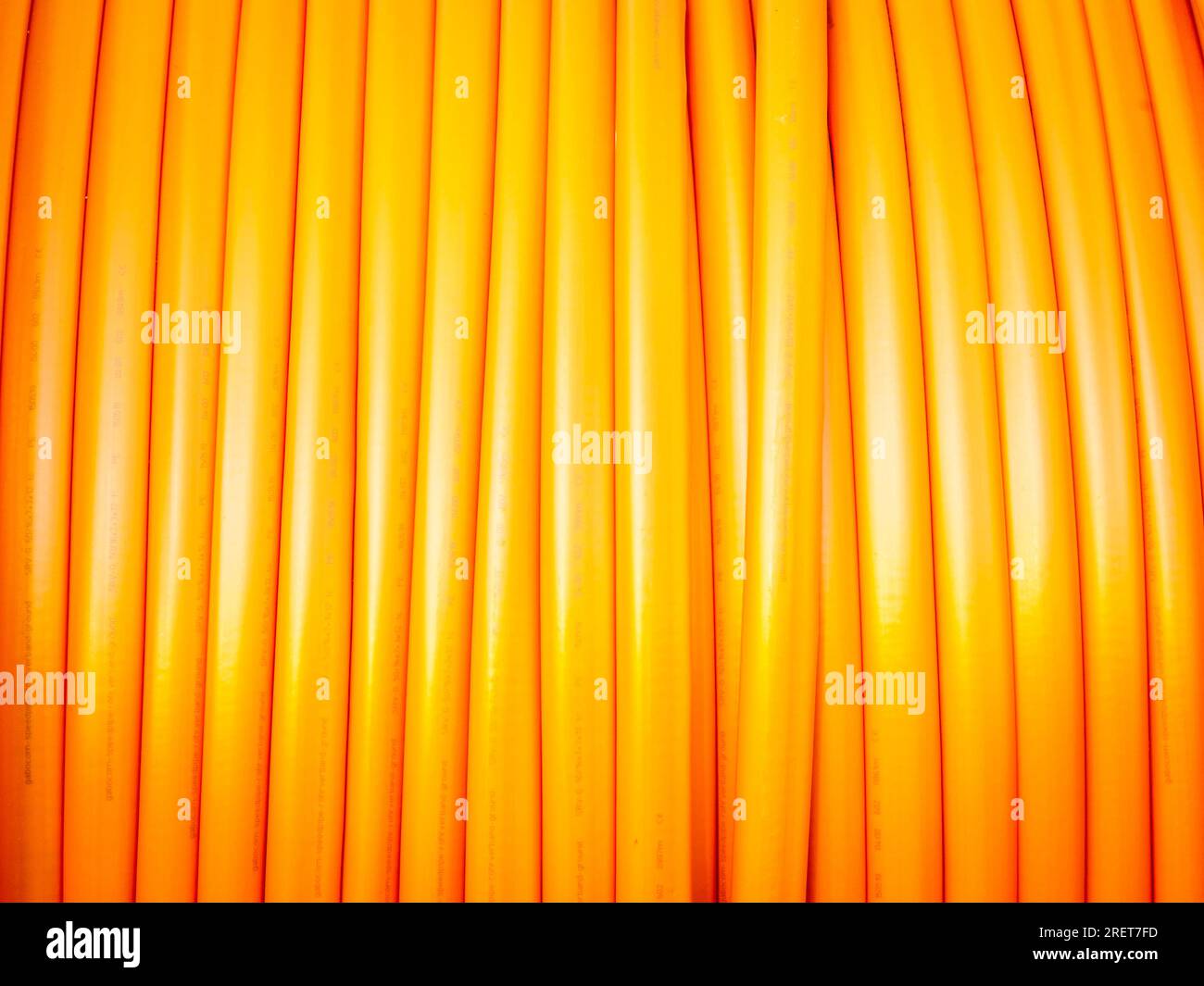 Communication cable in orange on a roll Stock Photo - Alamy