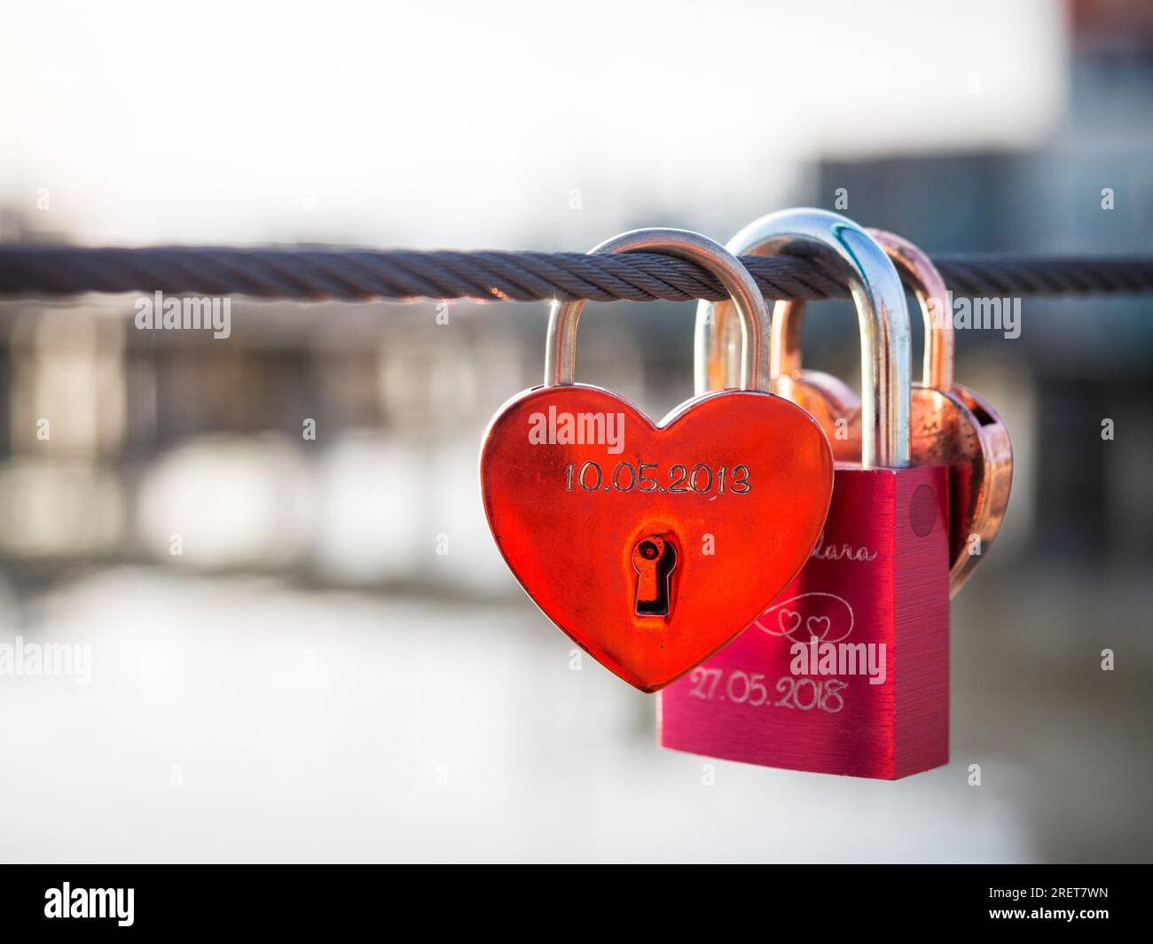 Padlock on a bridge love romance sign Stock Photo - Alamy