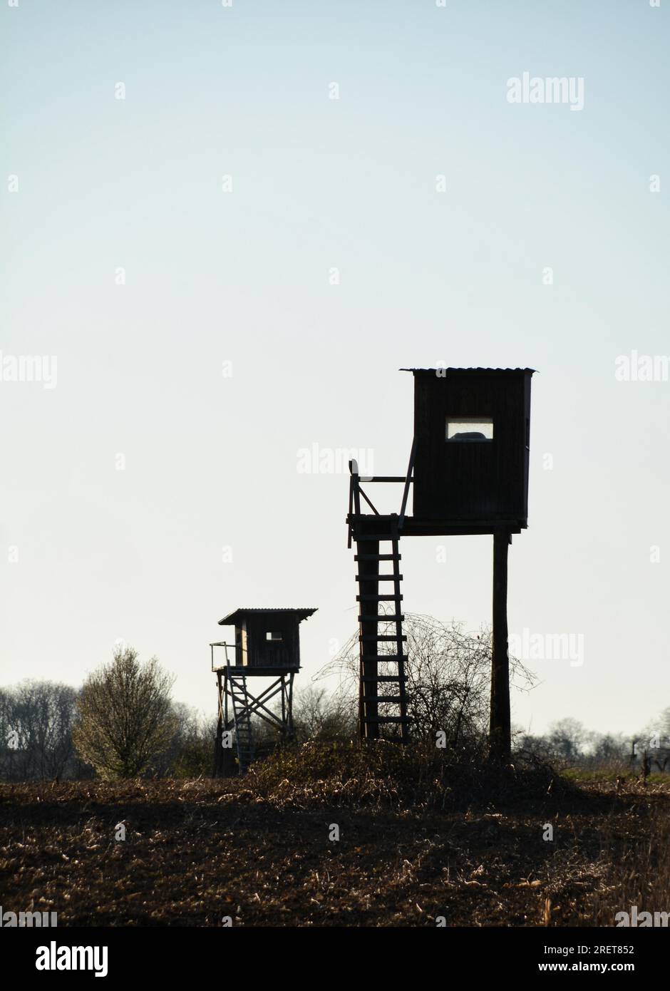 Watch towers on a border in a field Stock Photo - Alamy