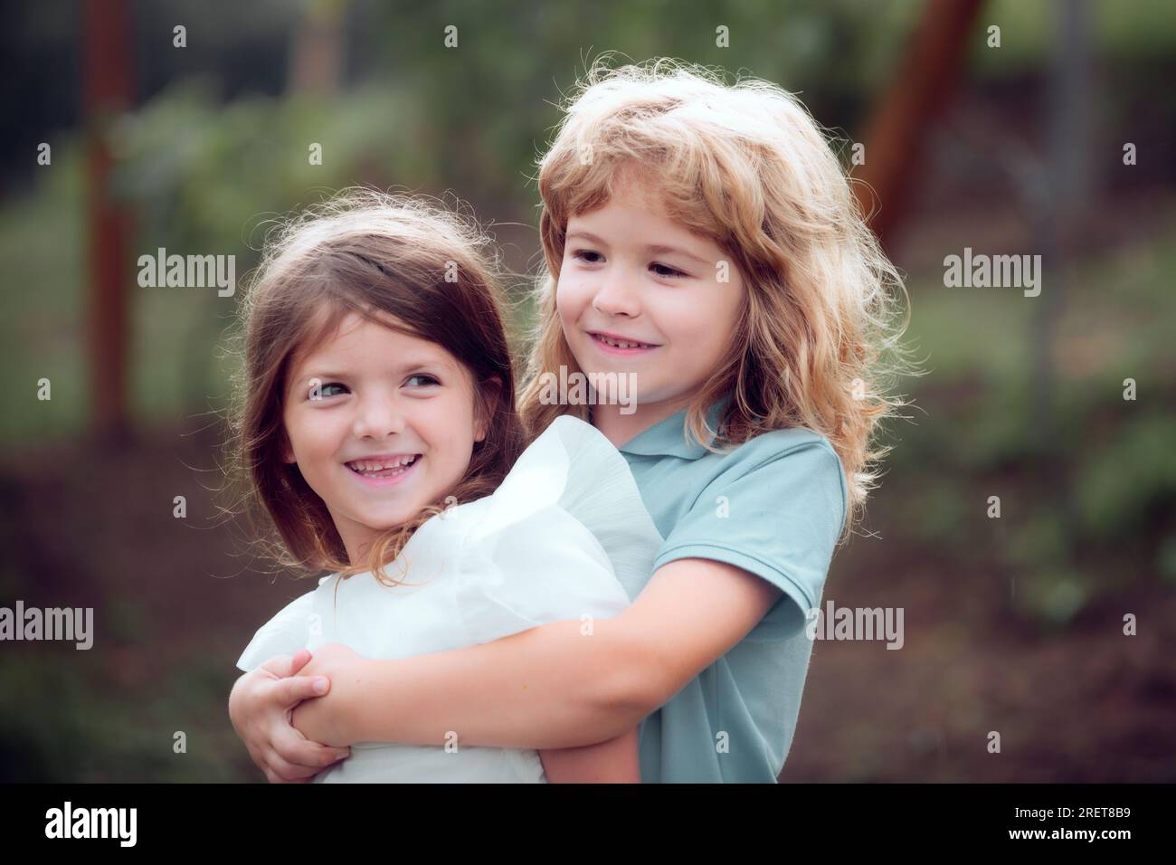 Little boy hugging shy girl, toddler boy embracing depressed little ...