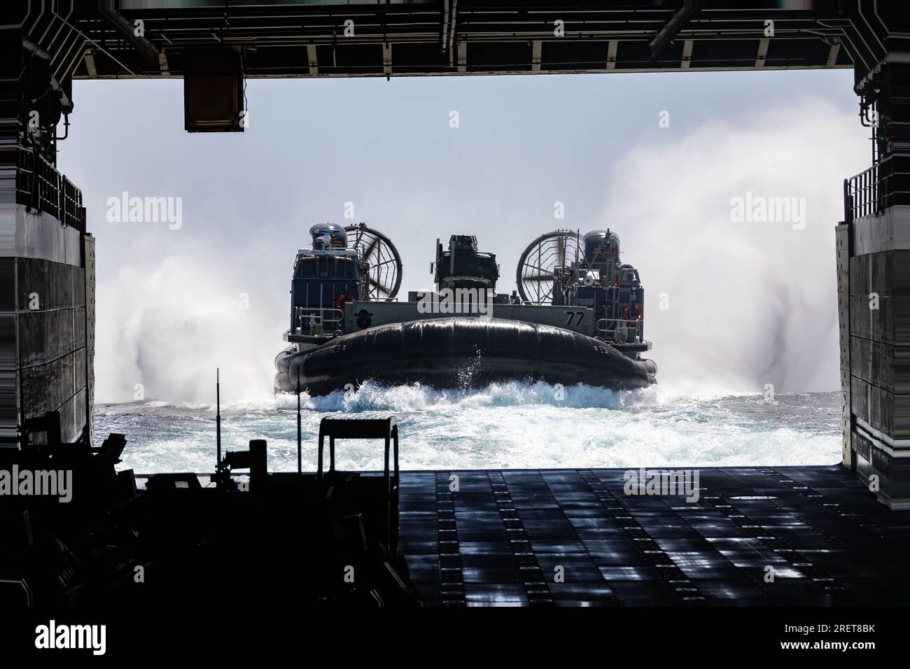 A U.S. Navy LCAC enters the well deck of the San Antonio class ...