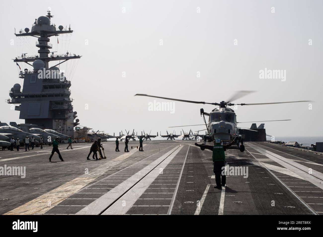 A British Royal Navy Commando Wildcat AH1 lands on the flight deck of ...