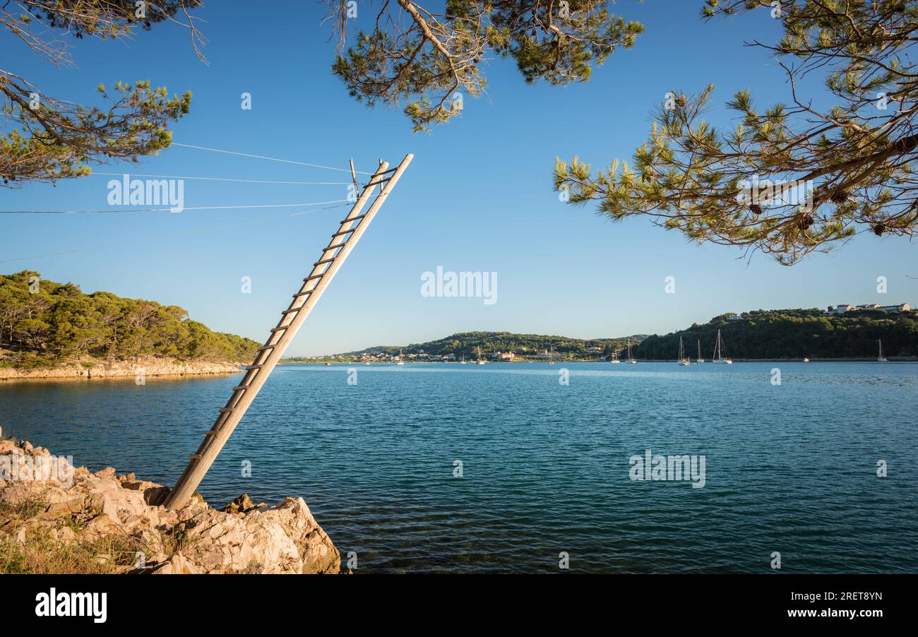 Beach ladder for fishing in croatia Stock Photo - Alamy