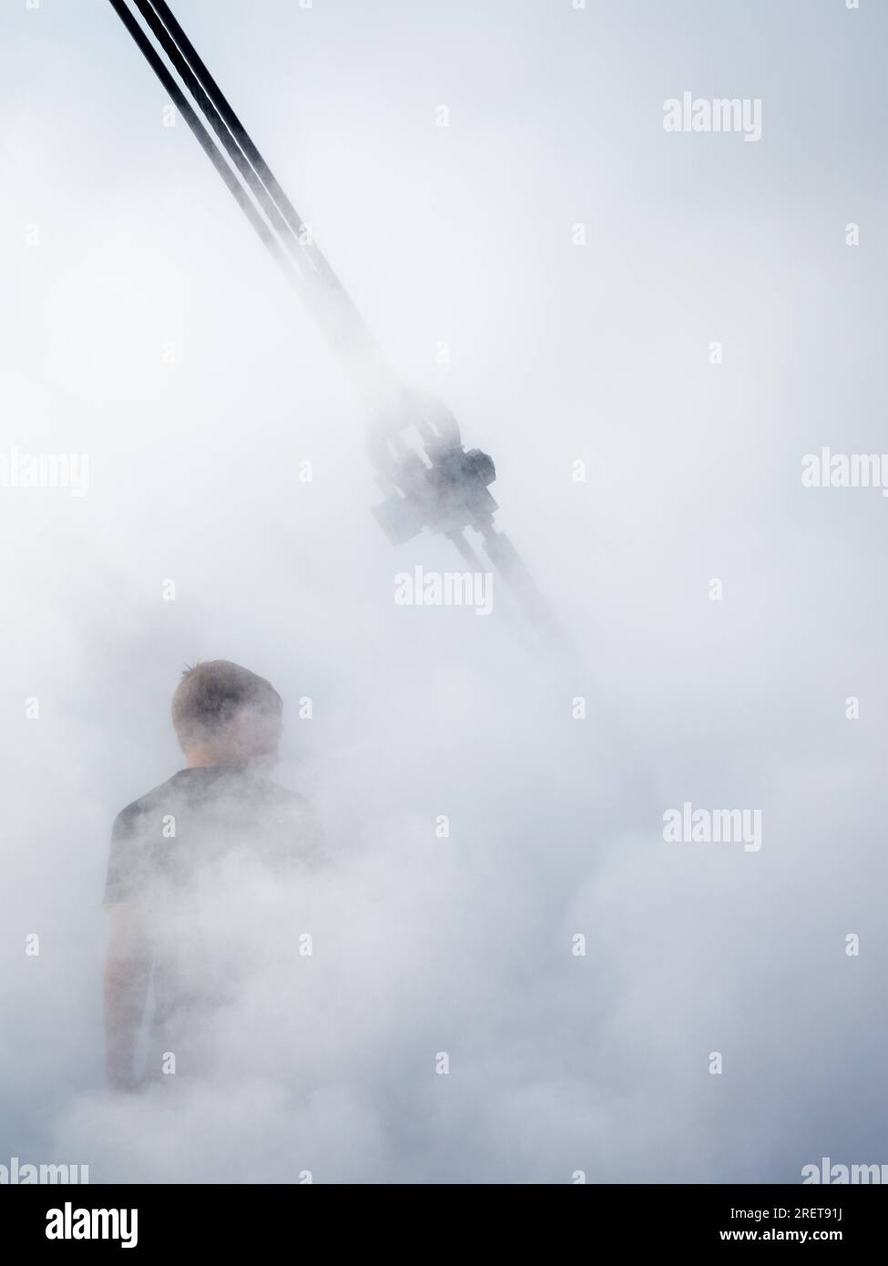 Kid in mist and fog on a stage Stock Photo - Alamy