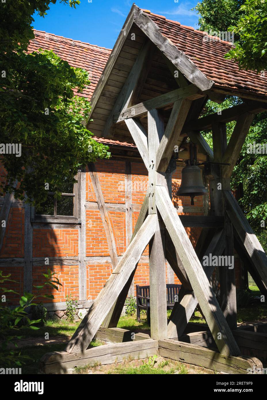Church bells mounted in high tower in the public square of a small ...