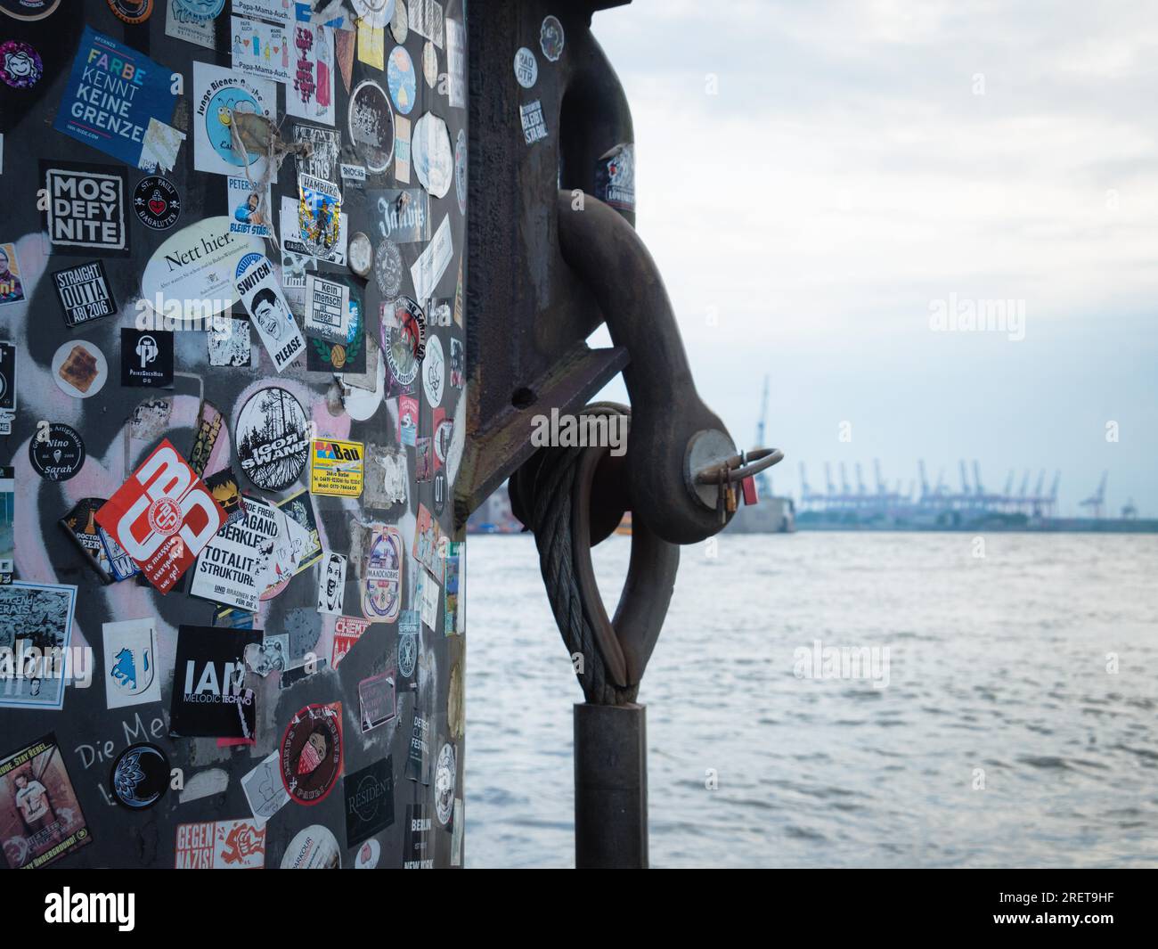 Stickers on a heavy bollard on hamburg landungsbruecken Stock Photo - Alamy