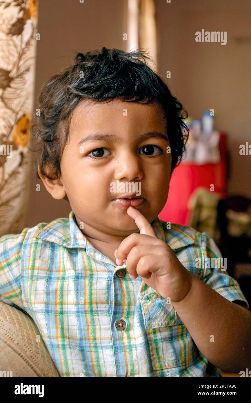 A south Indian 18 months old toddler boy Ashwin with cute expression ...