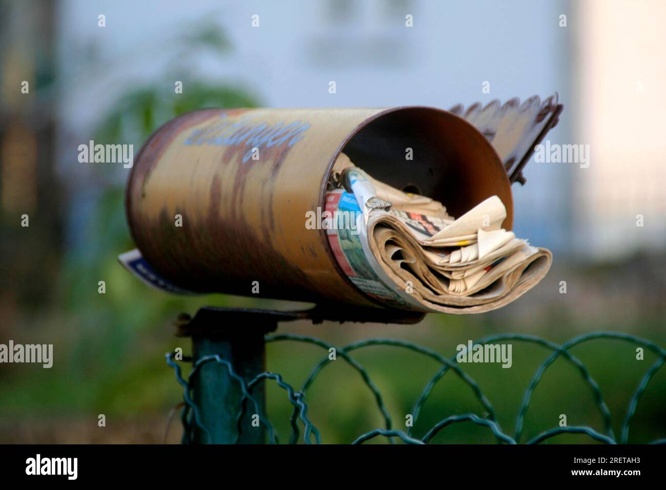 Old newspaper in front of an old abandoned house Stock Photo - Alamy