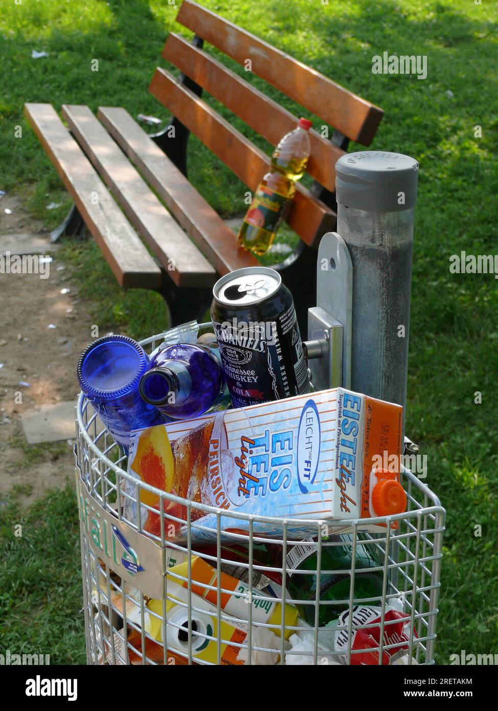 Overfilled litter bin, wastepaper bin with bottles and cans, beverage ...