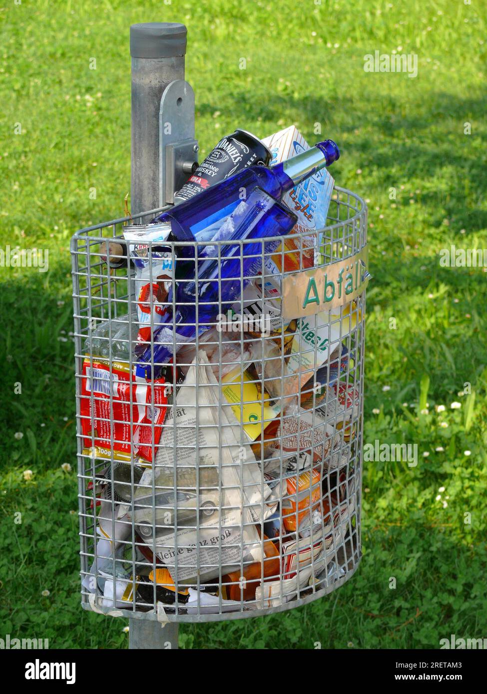 Overfilled litter bin, wastepaper bin with bottles and cans, beverage ...