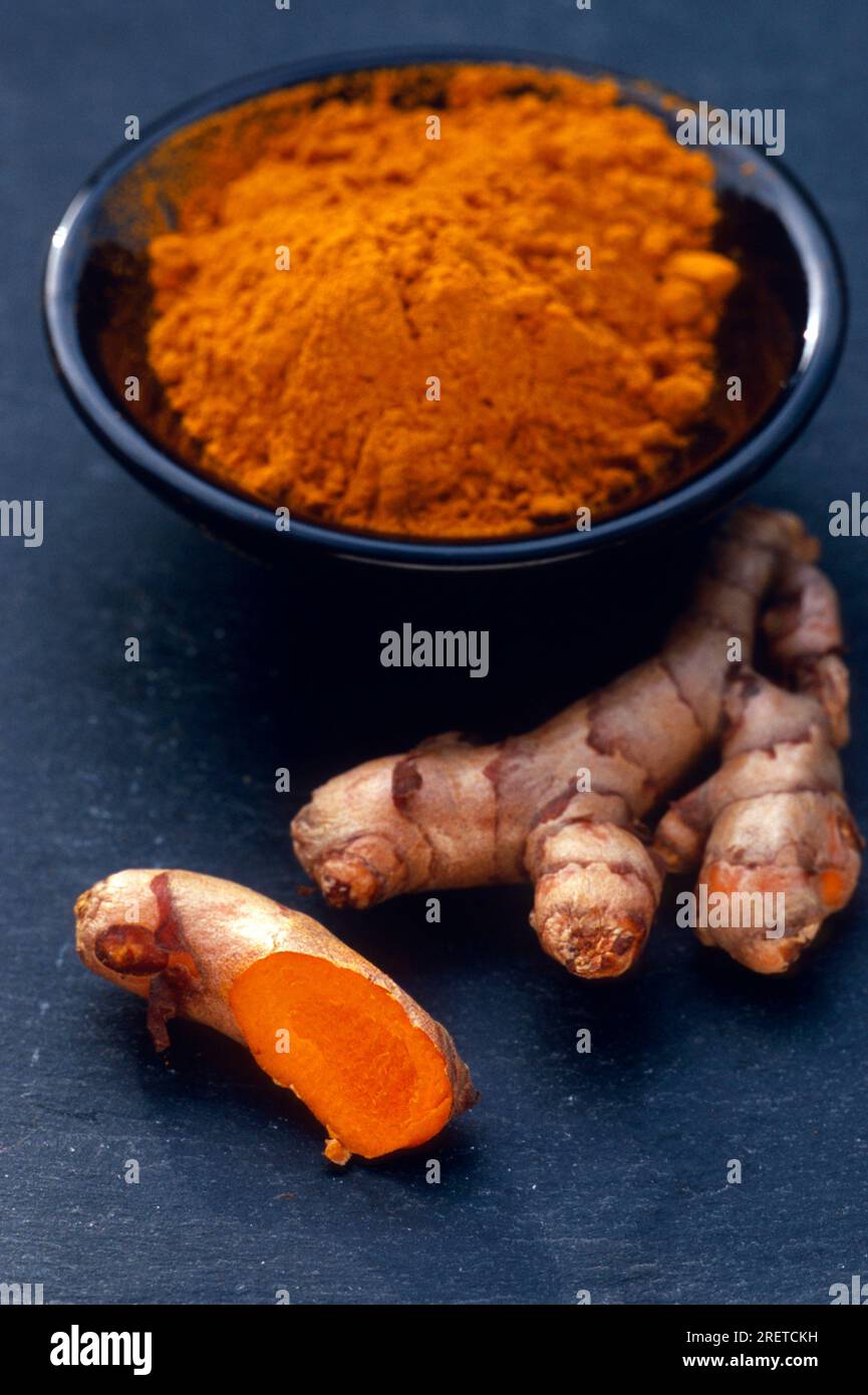 Turmeric powder and Turmeric (Curcuma longa) turmeric, turmeric root ...