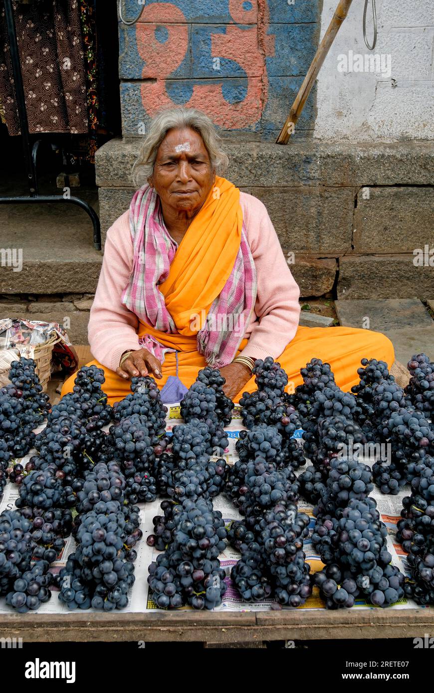 An old woman selling grapes near City Market in Bengaluru Bangalore ...