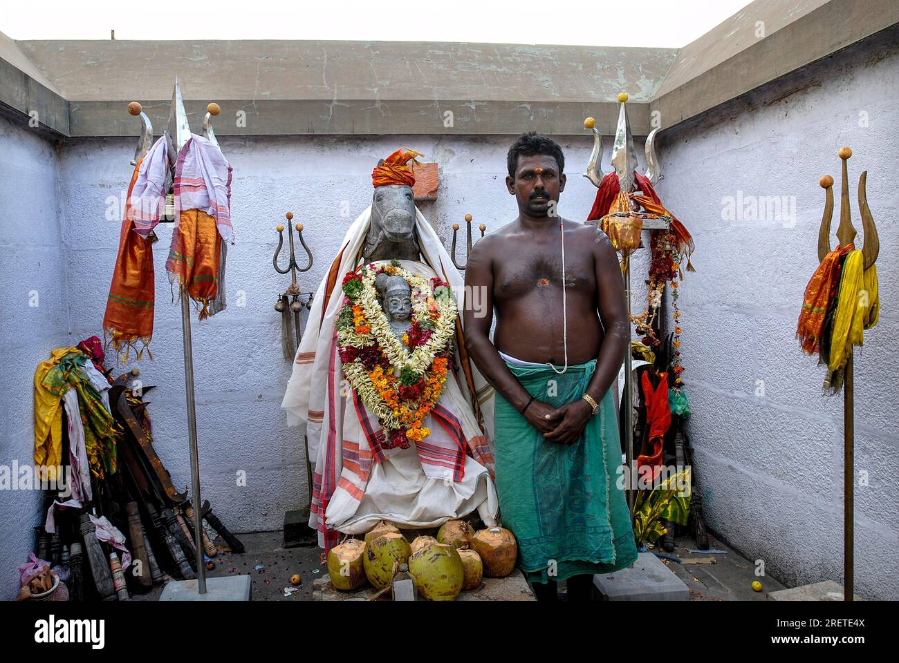 Poojari Priest standing near village Guardian deity at Moolankudi ...