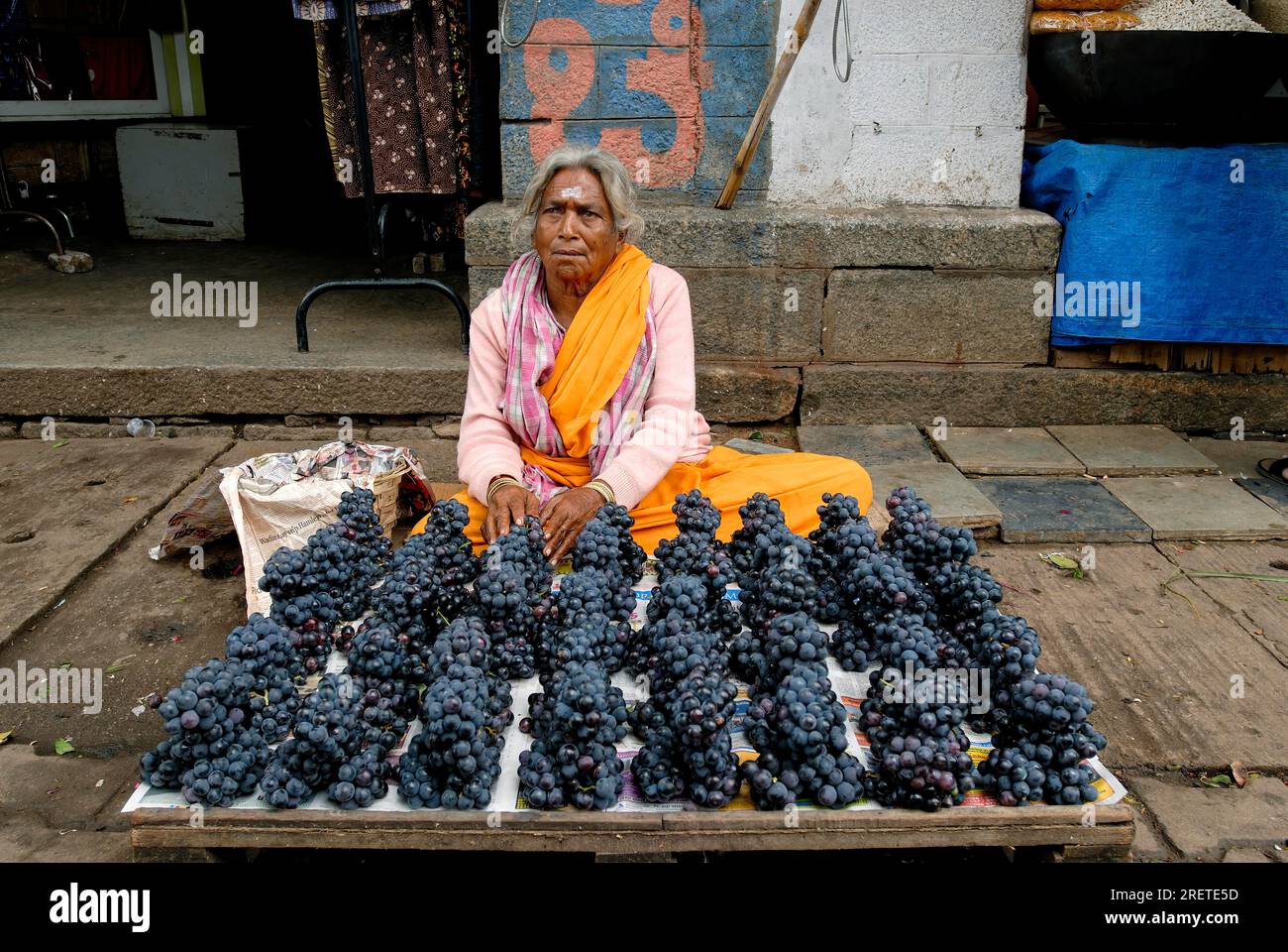 An old woman selling grapes near City Market in Bengaluru Bangalore ...