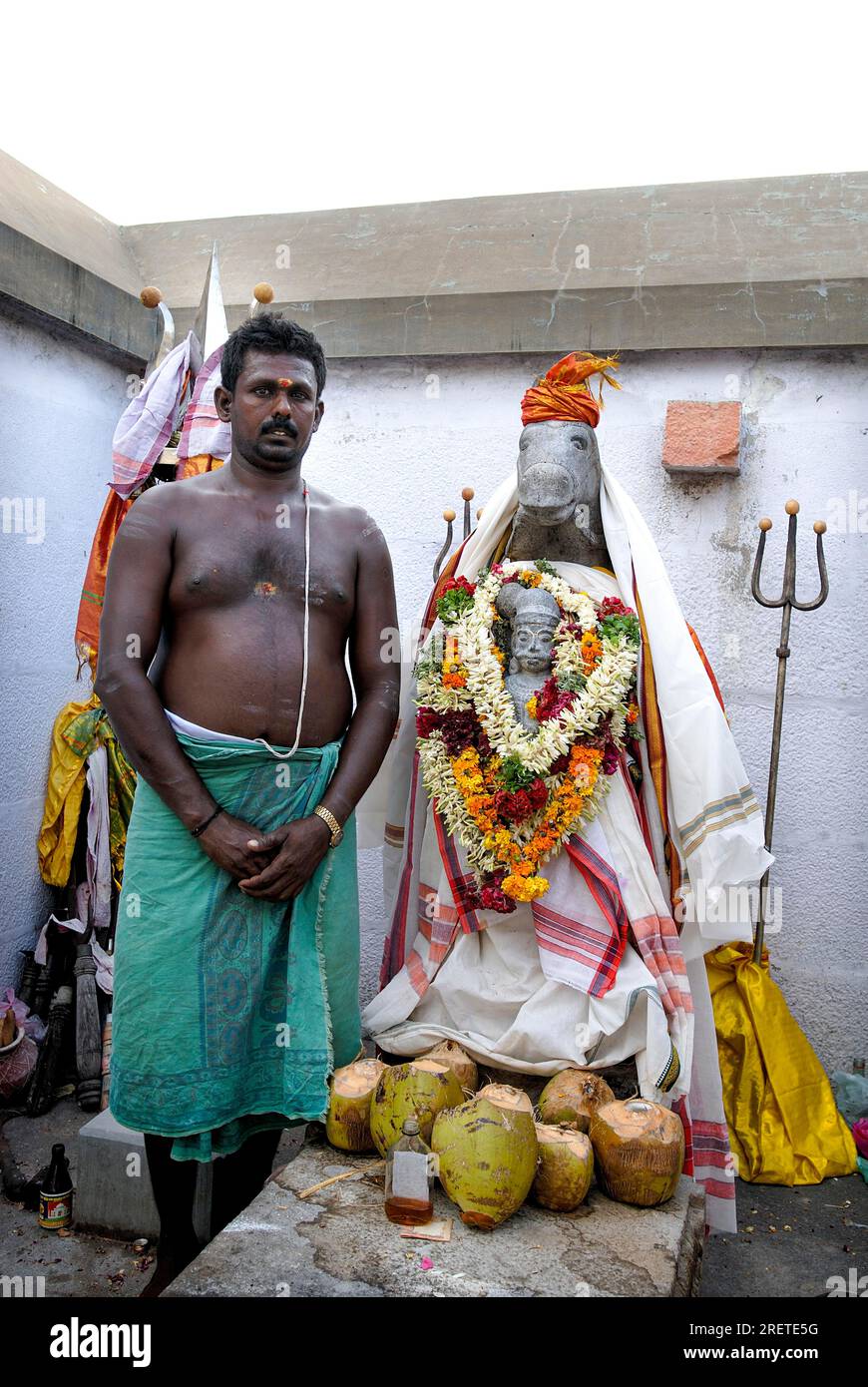 Poojari Priest standing near village Guardian deity at Moolankudi ...
