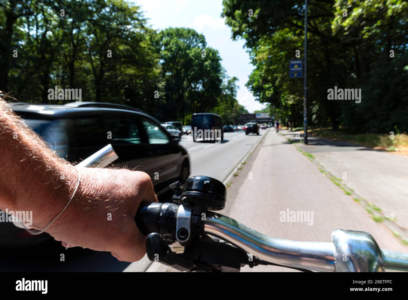 Cycling from a first-person perspective on a cycle path in Cologne ...