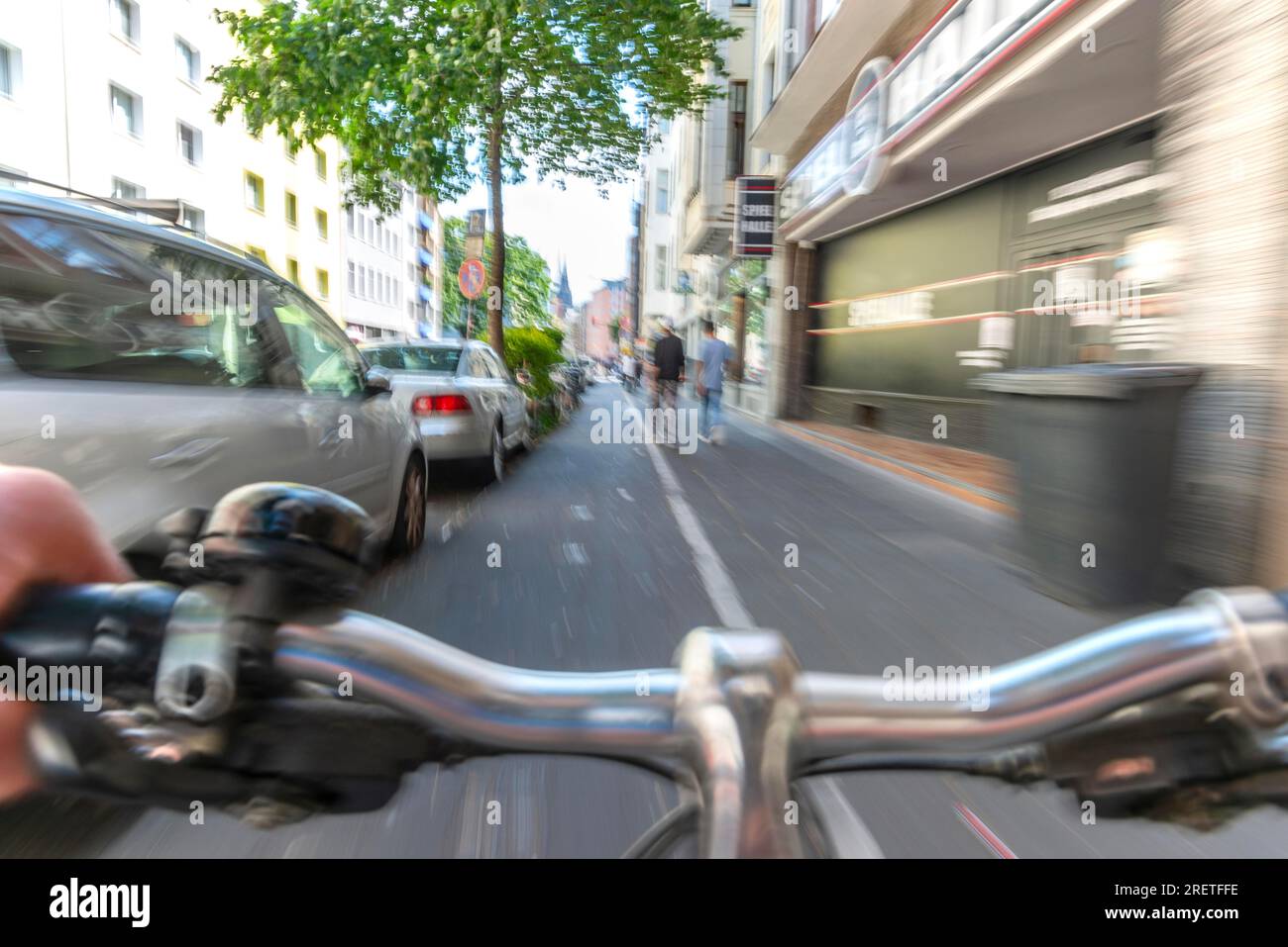 Cycling from a first-person perspective on a cycle path in Cologne ...
