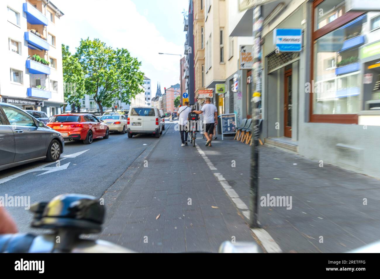 Cycling from a first-person perspective on a cycle path in Cologne ...