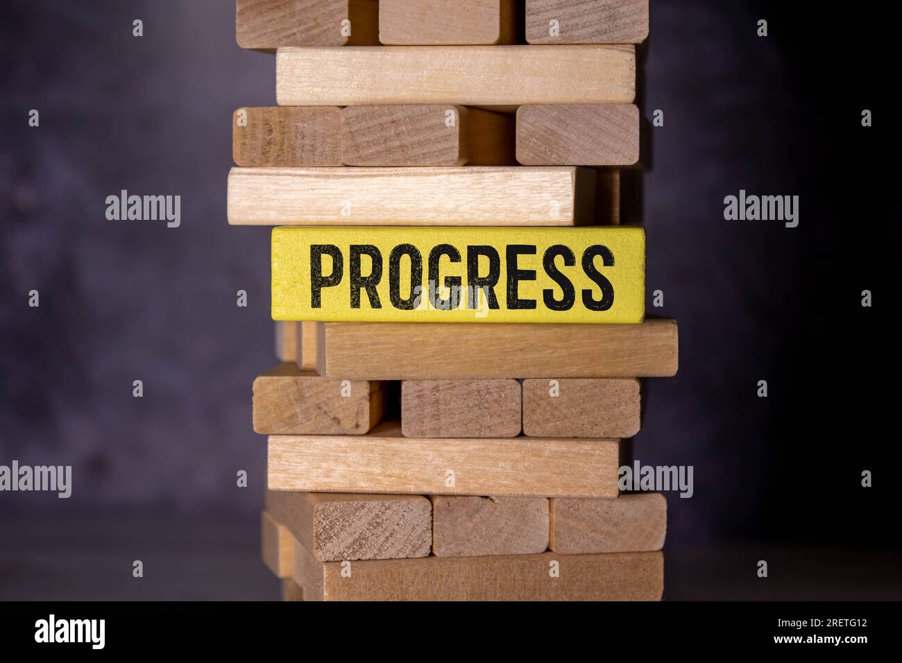 Work in progress warning sign text with yellow and black stripes ...