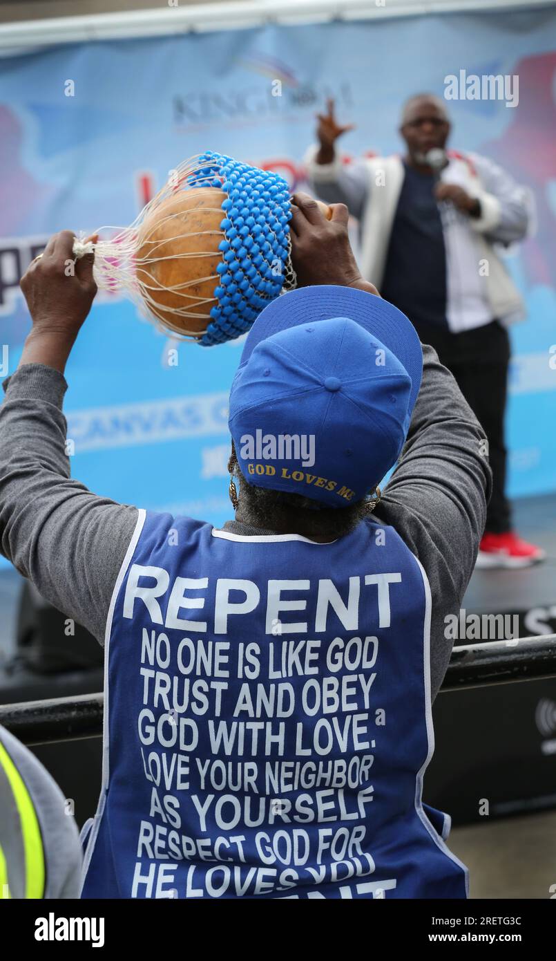 London, UK. 29th July, 2023. A worshiper listens to a speaker with ...