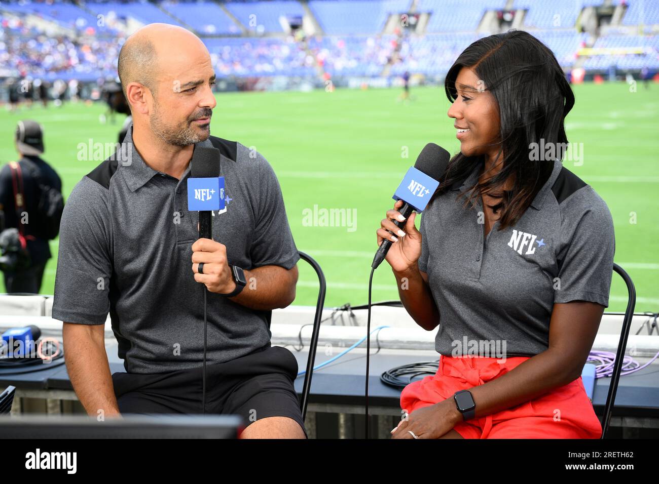 NFL Network reporters Mike Garafolo, left, and Sherree Burruss, right, report from Baltimore ...
