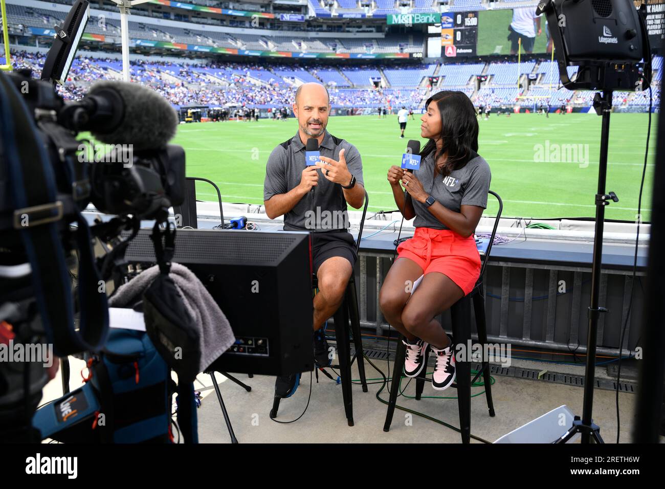 NFL Network reporters Mike Garafolo, left, and Sherree Burruss, right, report from Baltimore ...